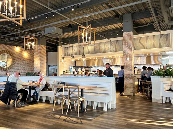 The warm interior blends industrial chic with homey comfort &ndash; those pendant lights could make anyone look like they're starring in their own food documentary.