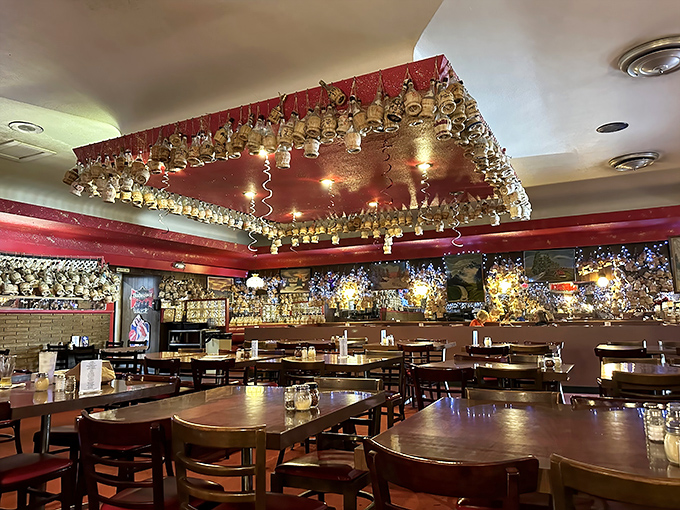 A ceiling draped with hundreds of Chianti bottles tells stories of countless celebrations, each one a testament to Detroit's enduring pizza love affair.