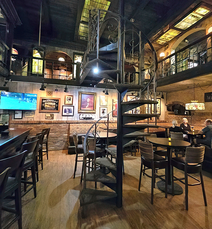 Multi-level dining with wrought iron and stained glass? It's like someone built a steakhouse inside a cathedral of carnivorous delights.