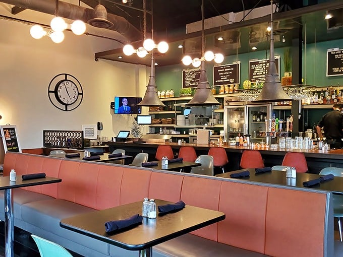 Retro meets modern in 24 Diner's interior, where coral booths and industrial lighting create the perfect backdrop for late-night conversations and early morning recoveries.