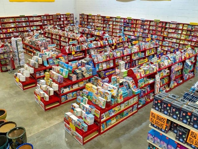 Book heaven exists, and it has red shelves! Rows upon rows of literary treasures await at prices that make bibliophiles weep with joy.