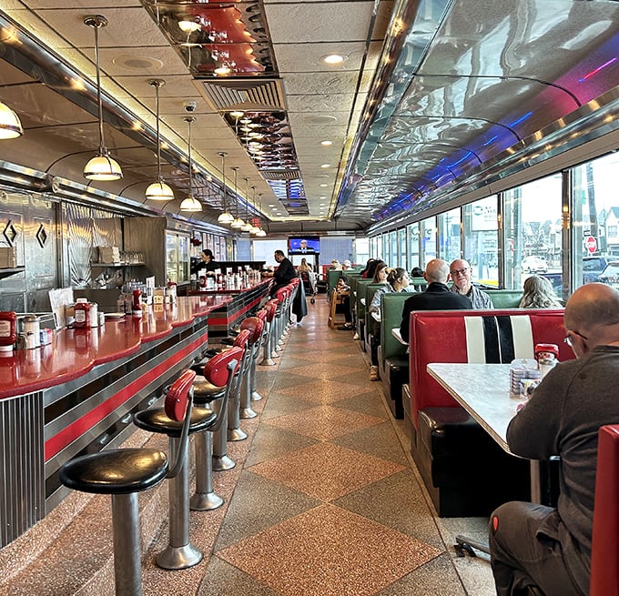 Classic diner interior where every booth holds a thousand stories and the coffee never stops flowing.