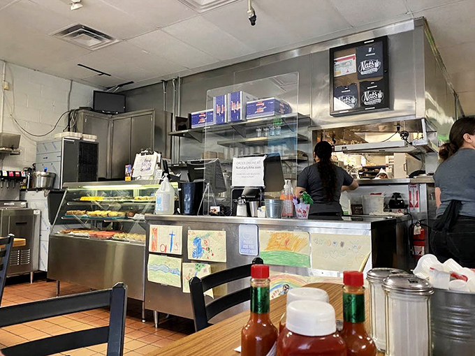 Classic diner vibes where every booth holds stories and the ceiling tiles have seen it all.