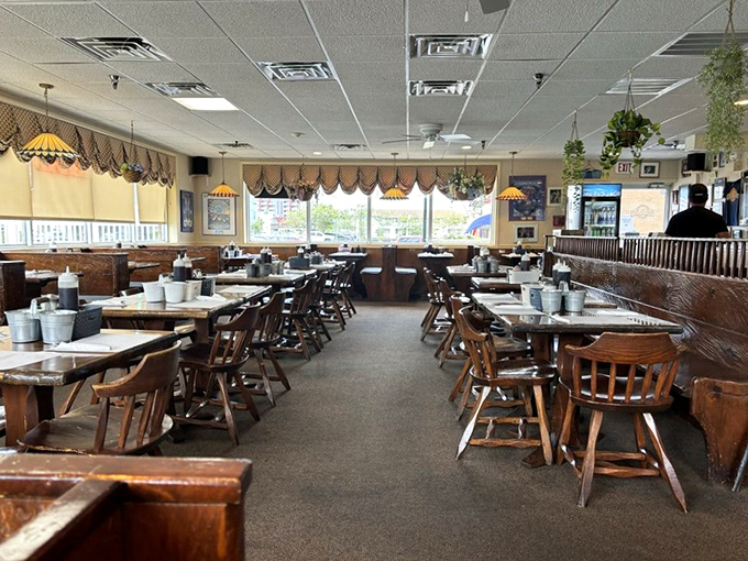 Wooden chairs, Tiffany-style lamps, and scalloped valances create that perfect "breakfast at a friend's house" vibe&mdash;if your friend were a breakfast wizard.