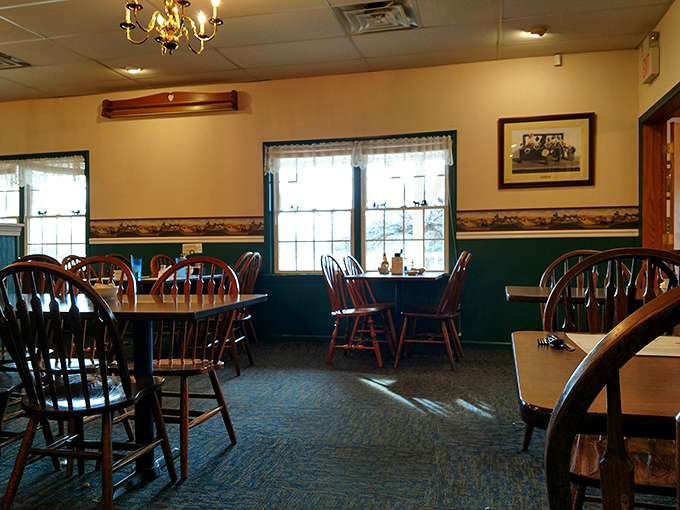 Windsor-back chairs and warm wood tones create that "grandma's dining room" feeling where comfort begins before the food arrives.