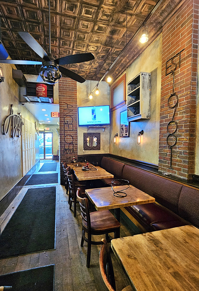 Narrow, intimate, and impossibly charming. The tin ceiling and exposed brick walls create a pizza sanctuary where time slows down just enough.
