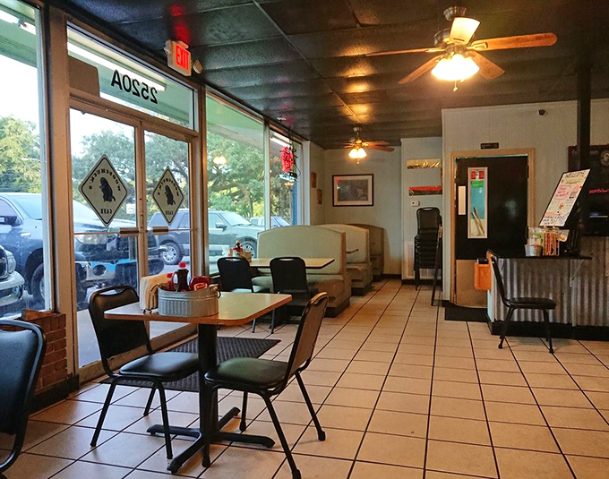 No-nonsense interior where the tiles have witnessed more coffee refills than a Senate filibuster.