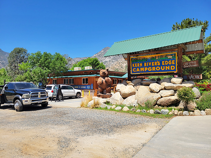 The Kern River's Edge Campground welcomes visitors with a wooden bear statue that's somehow both rustic and adorable—like a lumberjack's teddy bear.
