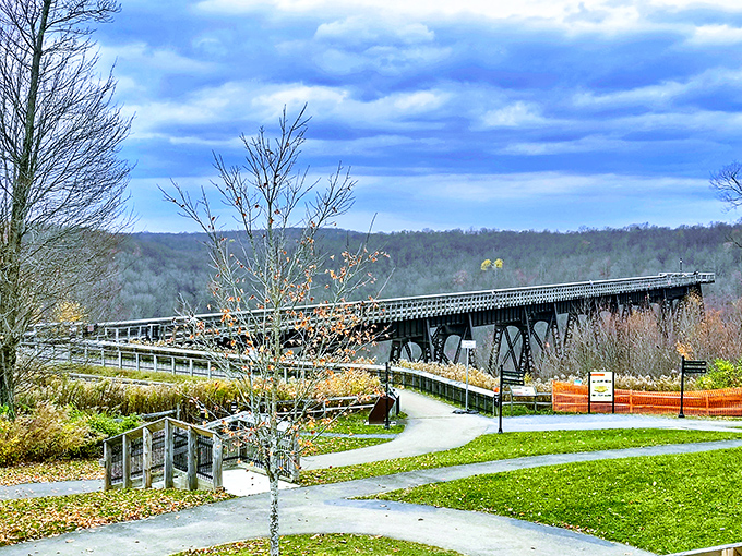Engineering marvel meets autumn splendor. The Kinzua Skywalk stretches into the distance, offering visitors a bird's-eye view of Pennsylvania's spectacular fall foliage.