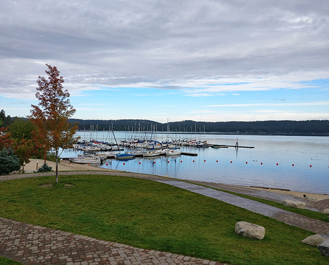 Sailboats rest like daydreams on Payette Lake's glassy surface. This marina view makes you wonder why you ever stress about deadlines or traffic.