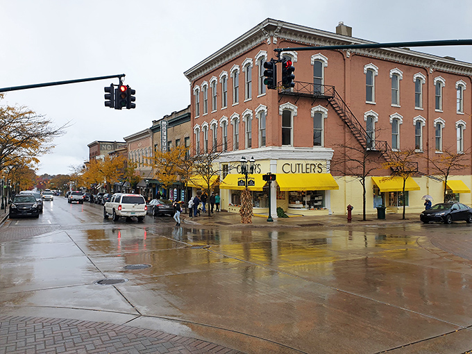 Rain-slicked streets make Cutler's yellow awning pop like a beacon of retail therapy against Petoskey's classic brick architecture.