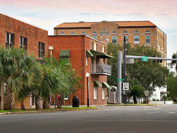 Brick buildings and palm trees create that perfect small-town Florida vibe where you can practically hear friendly conversations happening on every corner.
