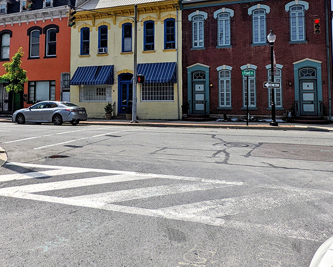 Colorful row houses stand like a welcoming committee, their distinct personalities a refreshing change from cookie-cutter suburban developments.