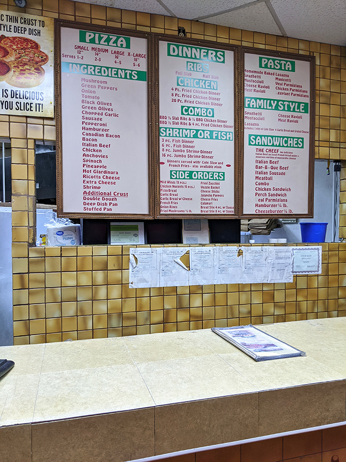 The menu wall&mdash;a yellow-tiled monument to possibility where indecision isn't a bug, it's a feature.