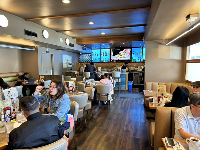 Inside, warm wood tones and comfortable seating create the perfect backdrop for morning conversations and coffee refills that never seem to end.