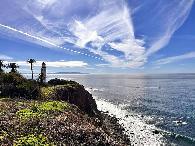 Mother Nature's own IMAX screen: dramatic cliffs, wispy clouds, and a lighthouse that's been photobombing vacation pictures since 1926.