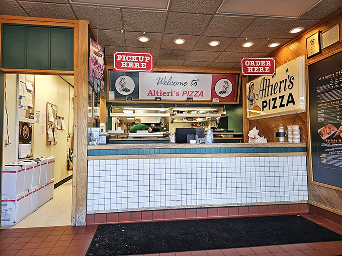 The quintessential pizza joint counter&mdash;where culinary dreams are ordered, magic happens behind the scenes, and happiness is picked up.