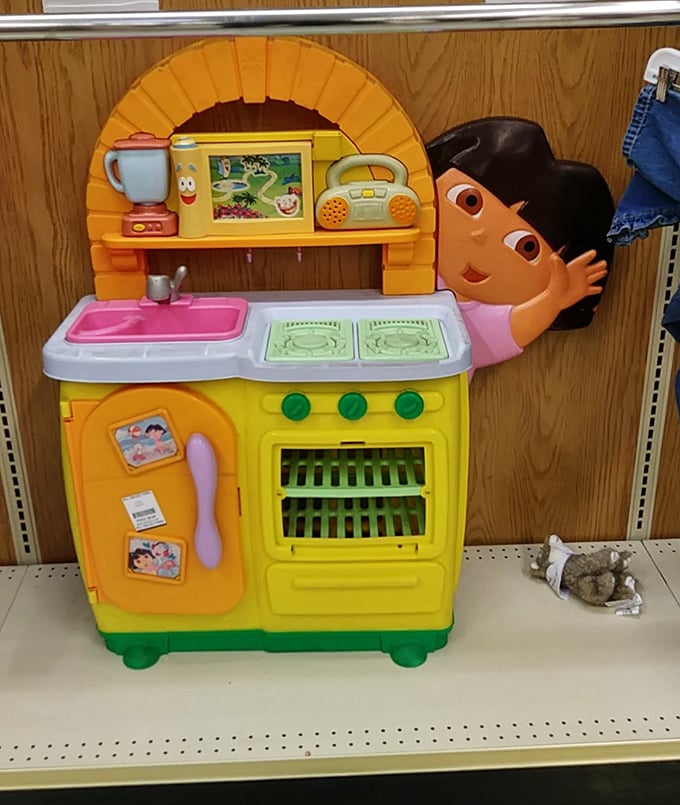 Someone's childhood dreams await new adventures. This colorful play kitchen has probably hosted more imaginary five-star meals than most real restaurants. 