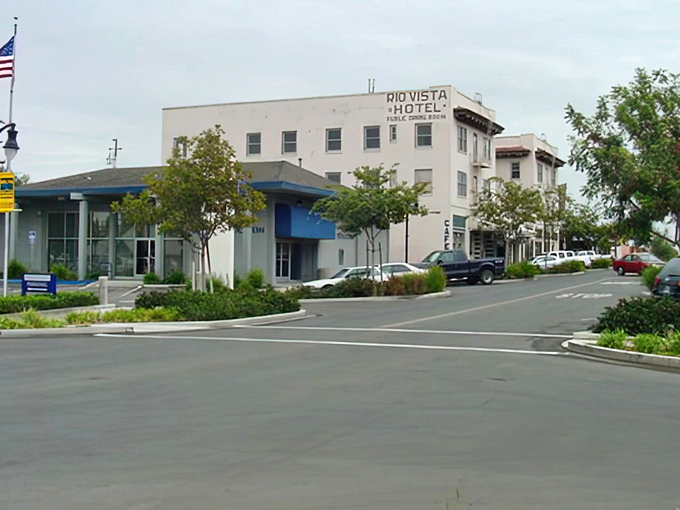 The iconic Rio Vista Hotel stands sentinel over downtown, a reminder that some landmarks don't need neon signs to announce their importance.