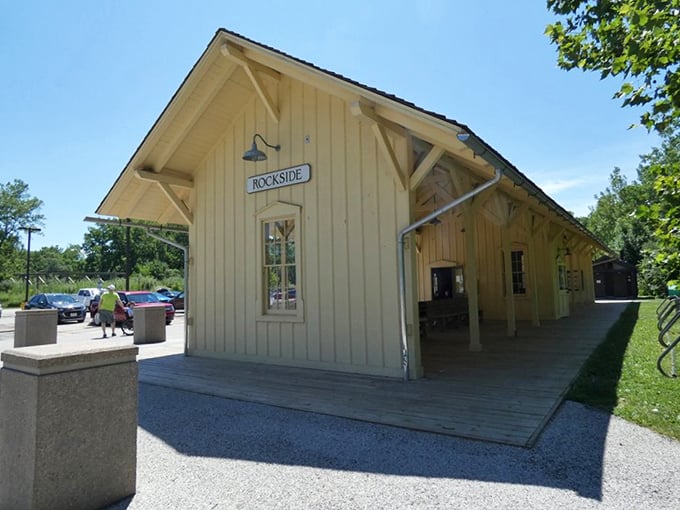The charming Rockside Station stands ready to welcome adventurers, its butter-yellow clapboard and wide porch evoking simpler times when journeys were events.