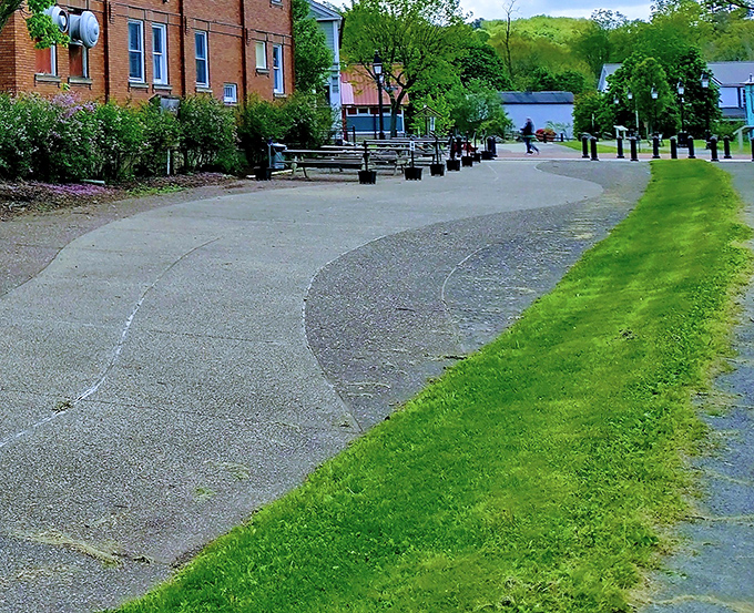 The curved pathway of Saltsburg Canal Park traces history's footsteps, offering a peaceful stroll where mule-drawn boats once transported goods.