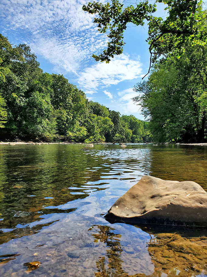 Sky and stream engage in casual conversation while rocks that have witnessed centuries patiently listen in.
