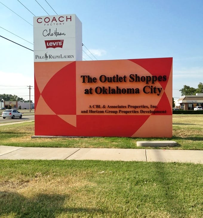 Brand name heaven beckons with this sign, a beacon of hope for fashionistas on a budget. 