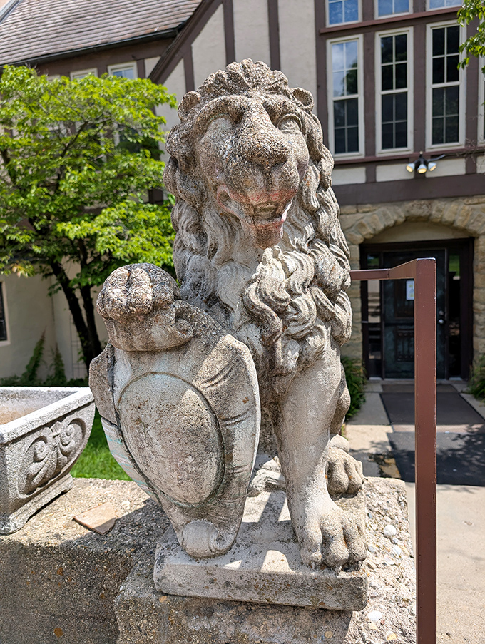 These weathered stone lions have stood sentinel for decades, guarding the castle entrance with the dignified weariness of longtime royal servants.