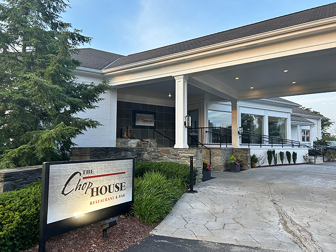 The Chophouse welcomes diners with elegant white columns and stone accents, promising an evening of culinary sophistication in unexpected places.