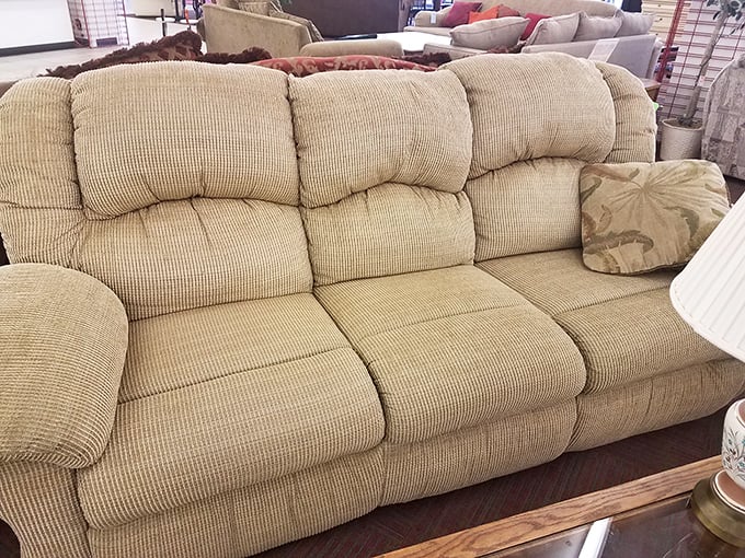 This beige three-seater sofa isn't just comfortable&mdash;it's a conversation starter waiting to happen in your living room at a fraction of retail price.