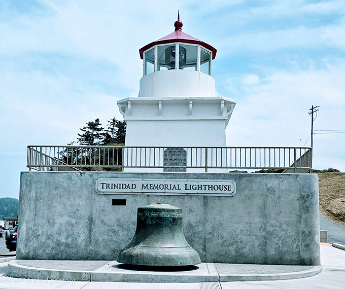The Trinidad Memorial Lighthouse stands guard like a maritime sentry, its crisp white exterior a beacon to both ships and Instagram feeds.
