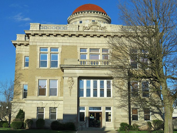 The Warren County Courthouse stands proud with its distinctive dome, like a stately grandfather overseeing the town with dignified authority.