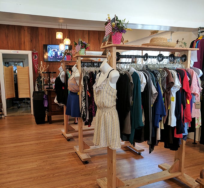 Fashion democracy in action – wooden racks display everything from casual tees to elegant dresses, all waiting for their second chance at making someone feel fabulous.