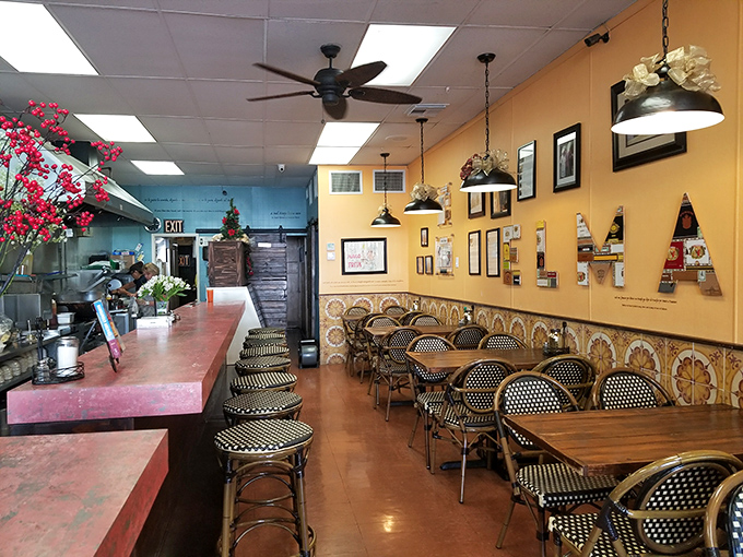 Yellow walls adorned with memories and bistro chairs that have supported countless happy diners&mdash;this is where frita dreams come true.