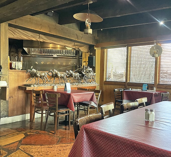 Rustic wooden beams, horse sculptures, and checkered tablecloths create that perfect "I've discovered somewhere special" feeling that chain restaurants spend millions trying to fake.