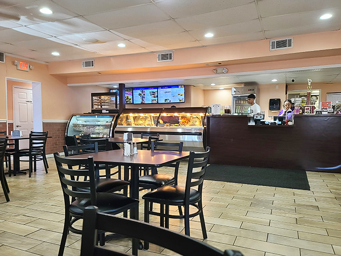 Inside, simplicity reigns supreme. No distractions here, just the promise of authentic island flavors that'll make you forget you're in Aberdeen.