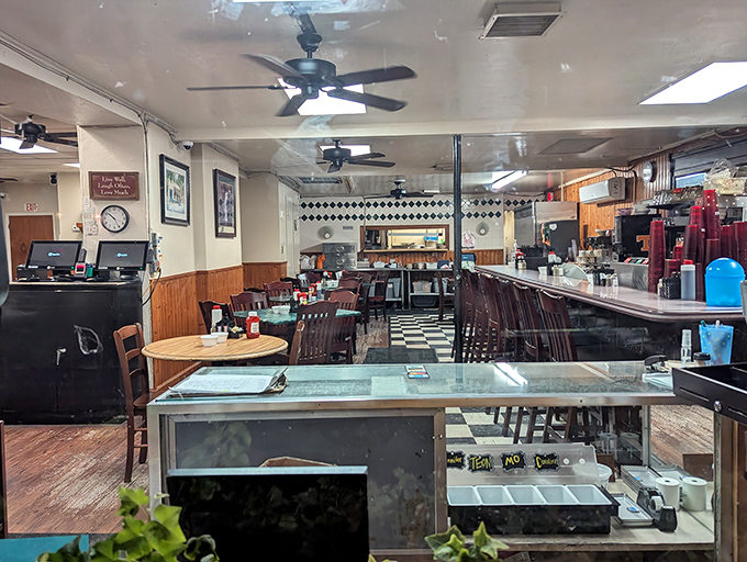 Classic diner charm at its finest &ndash; black and white checkered floors, wooden paneling, and ceiling fans that have witnessed countless Savannah mornings.