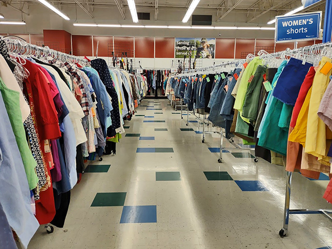 Rainbow rows of possibility! The women's clothing section offers everything from casual tees to elegant evening wear, each garment holding stories from its previous life.