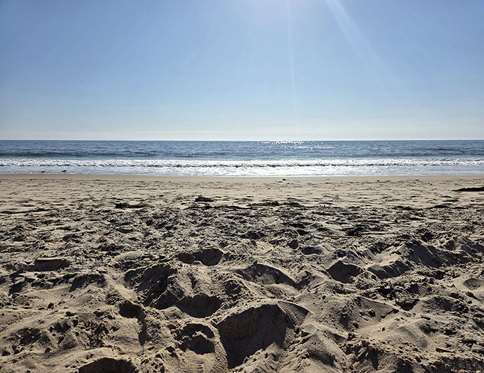 Footprints that disappear with the tide &ndash; nature's way of saying "no evidence, no problem." The perfect sandy canvas for temporary art.
