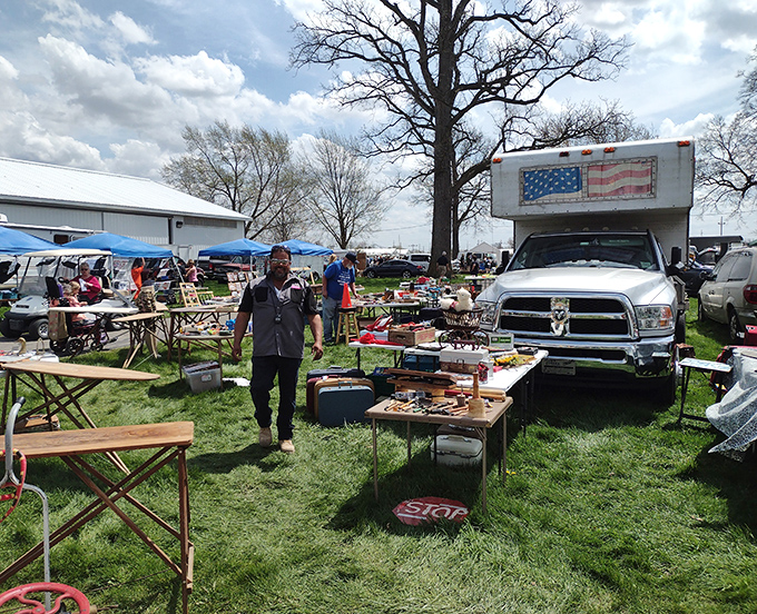Where one person's "stuff" becomes another's treasure. Vendors display their wares on tables while shoppers navigate the grassy pathways of possibility.