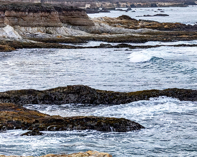 Where land meets sea in dramatic fashion. These rugged rock formations have been perfecting their pose for millennia, and they've definitely earned their close-up.