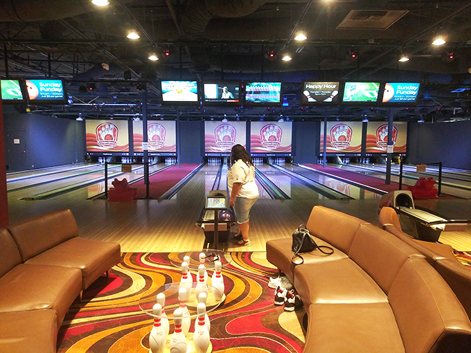 Not just shopping! The center's bowling alley offers a stylish retreat when your credit card needs a timeout. Those curved lounges are practically begging for a victory sit.