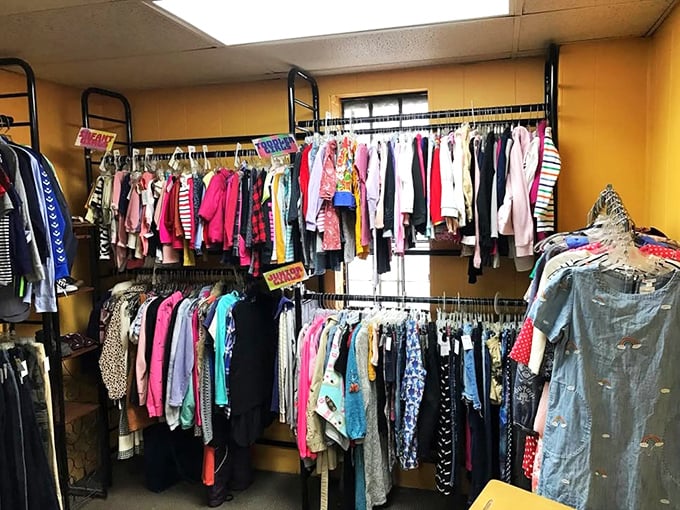 Racks bursting with possibility—each hanger holds not just clothing, but potential new identities and second chances for both garments and shoppers.