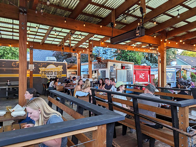 Communal tables under rustic wooden beams create the perfect setting for meat-induced happiness. Strangers become friends over brisket.