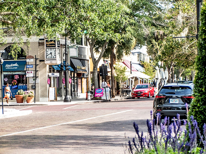 Park Avenue's charming storefronts invite leisurely exploration, where even the lavender plantings seem to whisper, "Slow down, you're on vacation time now."