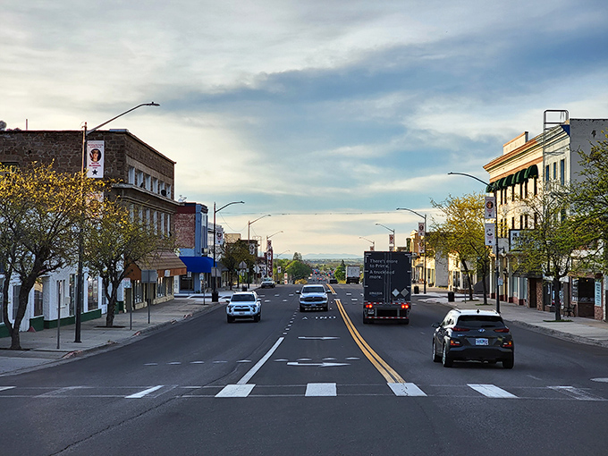 Downtown Susanville at dusk, when the golden hour transforms brick facades into a warm tableau that Norman Rockwell would've rushed to paint.
