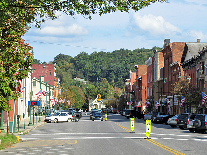 American flags flutter along Brookville's charming downtown, where brick buildings whisper stories of simpler times and neighbors still wave hello.