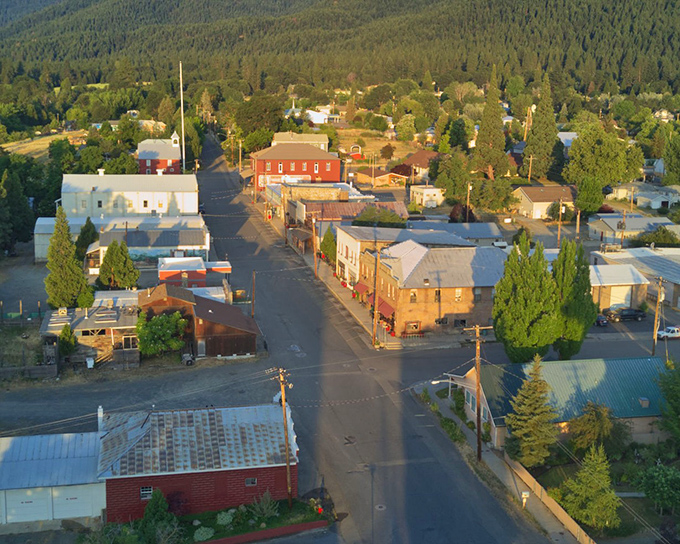 Bird's eye bliss! Etna's perfect grid nestled against forest-covered mountains looks like someone designed the ideal small town from scratch.