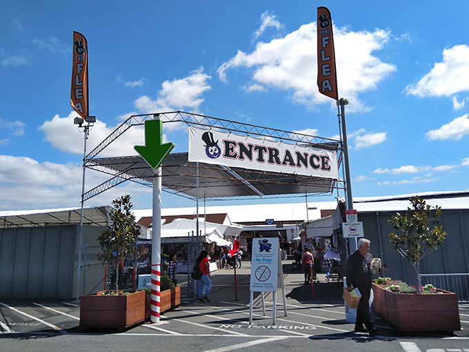 Follow the green arrow to retail therapy. This entrance isn't just a gateway&mdash;it's a portal to a parallel universe where haggling is an Olympic sport.