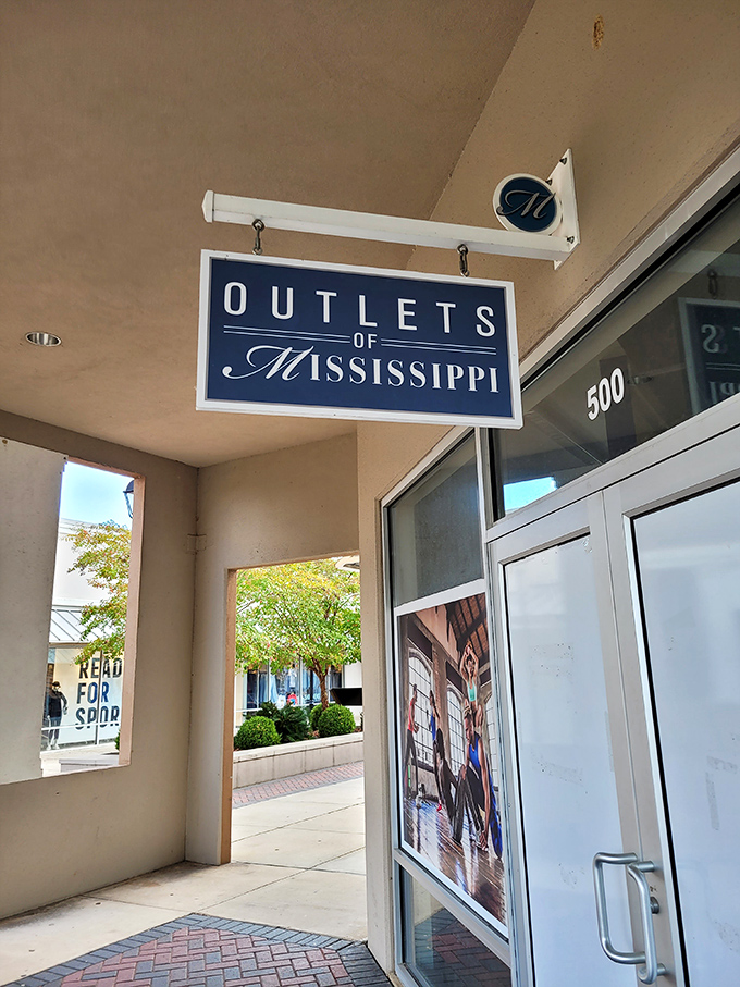 That elegant navy and white sign promises what lies beyond: a wonderland where designer dreams meet wallet-friendly reality.